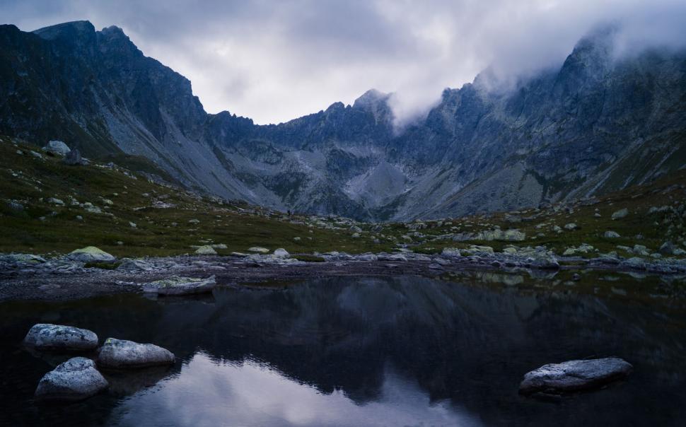 Free Stock Photo of Mountain range with misty peaks and a calm lake ...