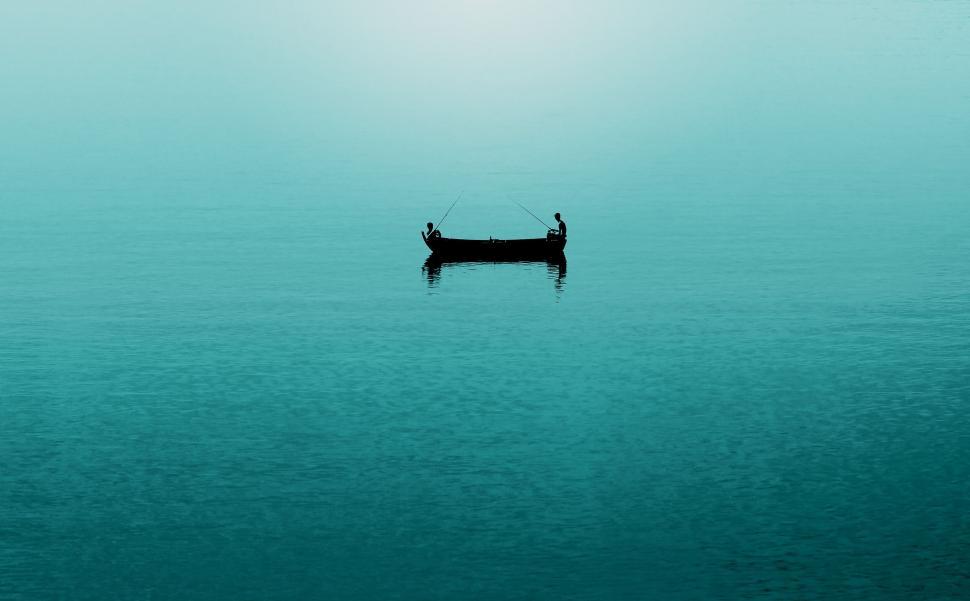 Free Stock Photo of Two people fishing on a boat in a serene blue lake ...