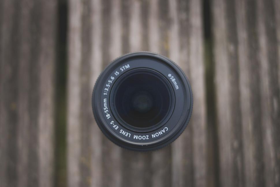 Free Stock Photo of Lens facing down on a wooden surface, top view shot ...