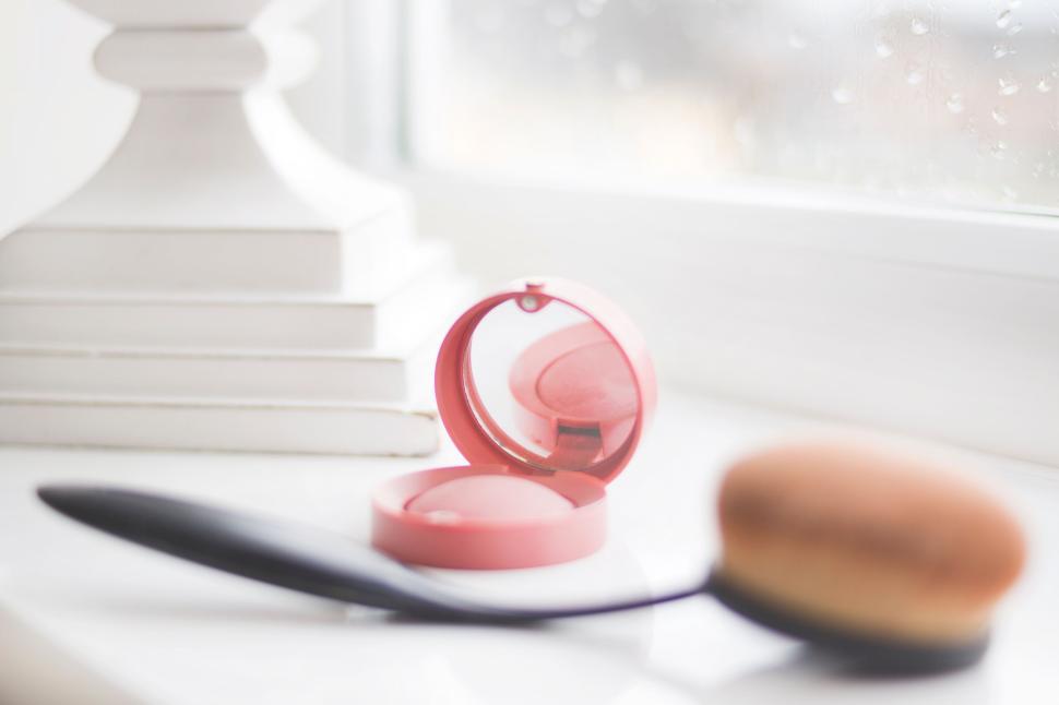 Free Stock Photo of Compact mirror case with makeup brush on table ...