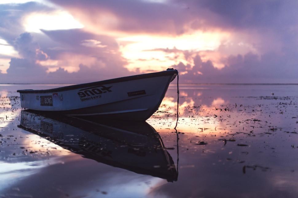 Free Stock Photo of Rowboat reflected in calm water during a serene ...