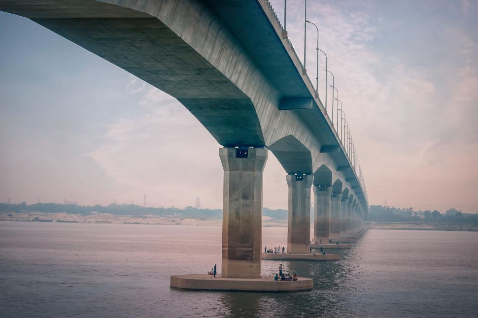 Free Stock Photo of Modern bridge structure extending over a wide river ...