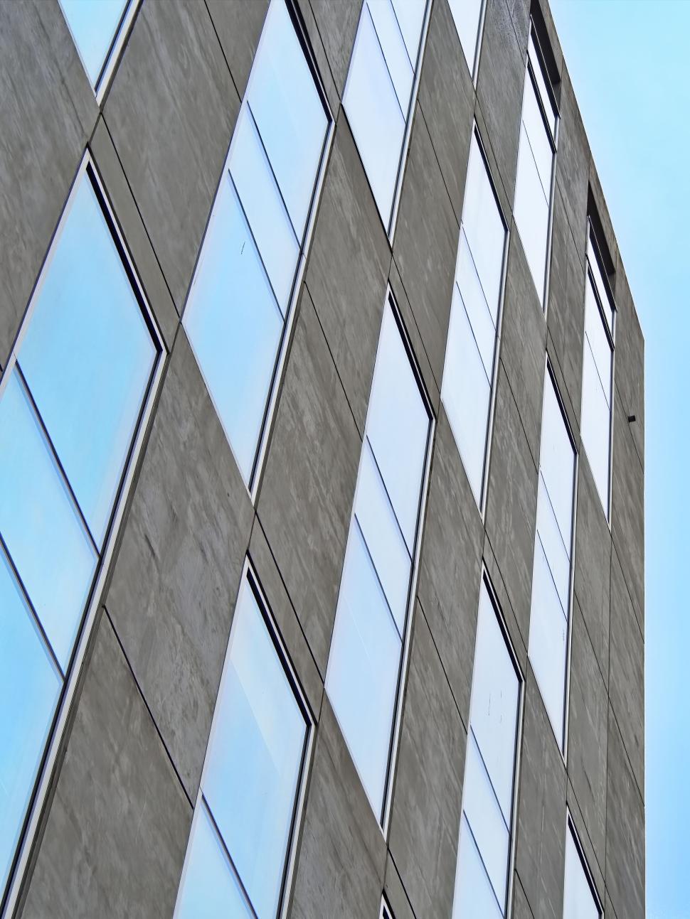 Free Stock Photo of Vertical grey building with checkerboard window ...