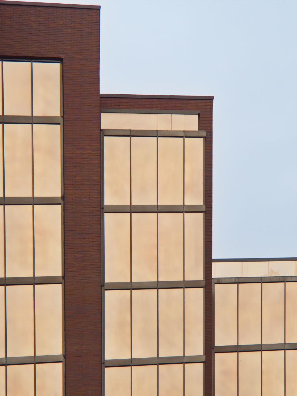 Free Stock Photo of Modern brown building facade with glass panel ...