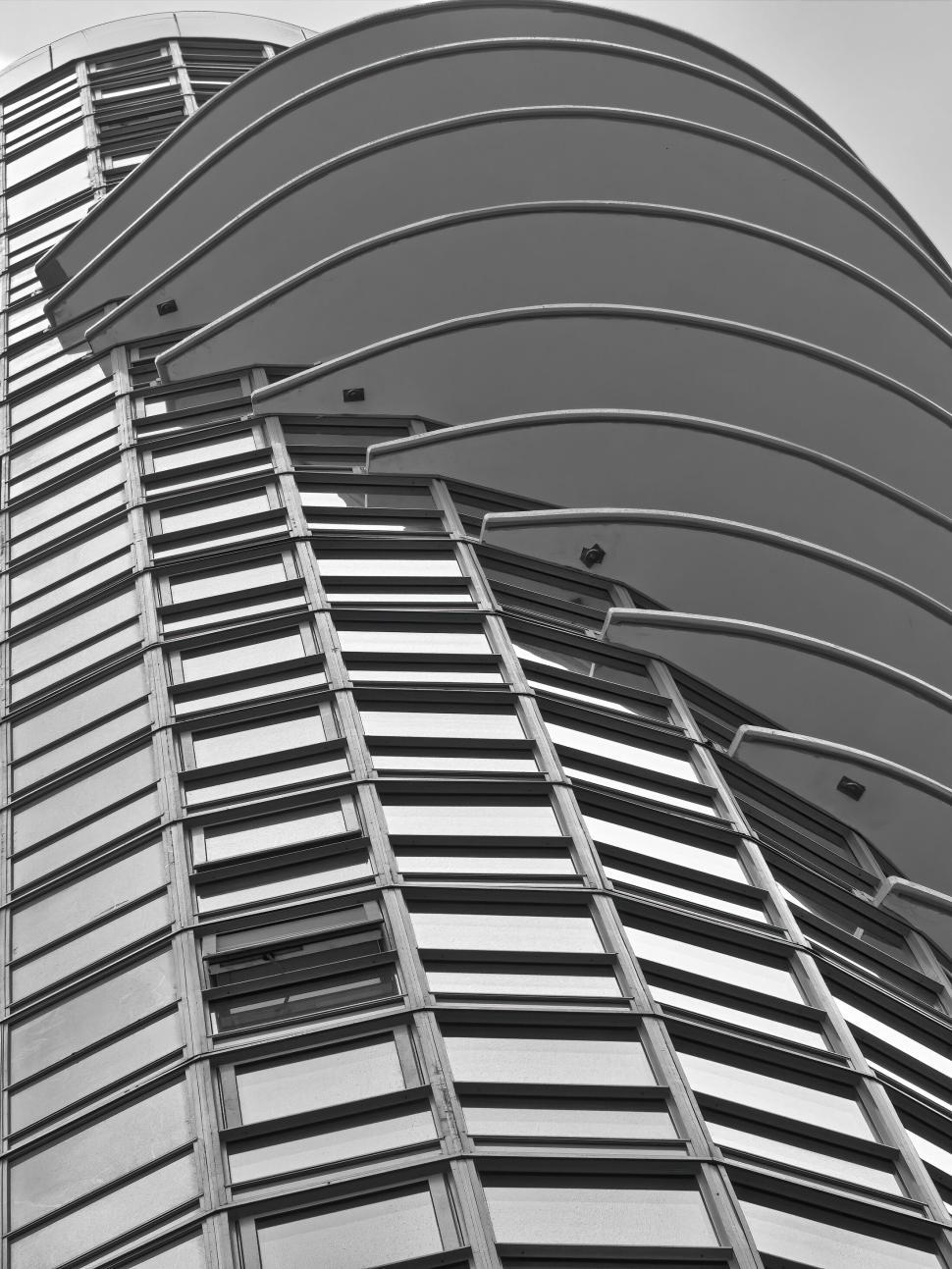 Free Stock Photo of Modern curved skyscraper with multiple segmented ...