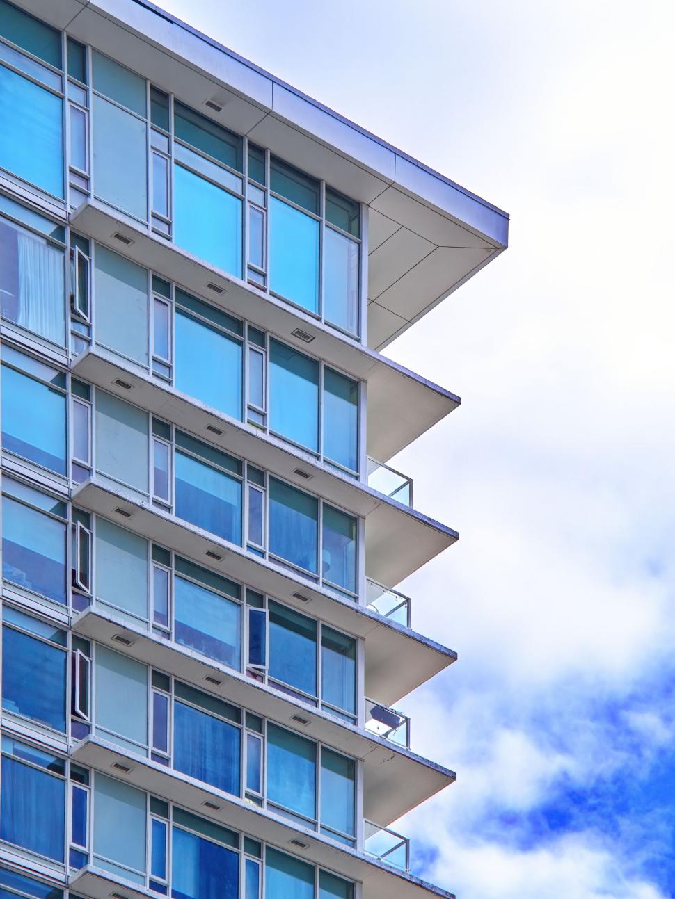 Free Stock Photo of High-rise building facade with blue tinted windows ...