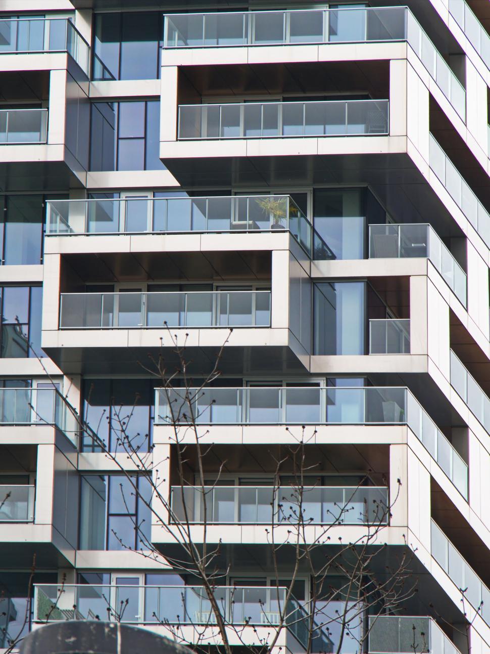 Free Stock Photo of Stacked glass balconies on a high-rise building ...