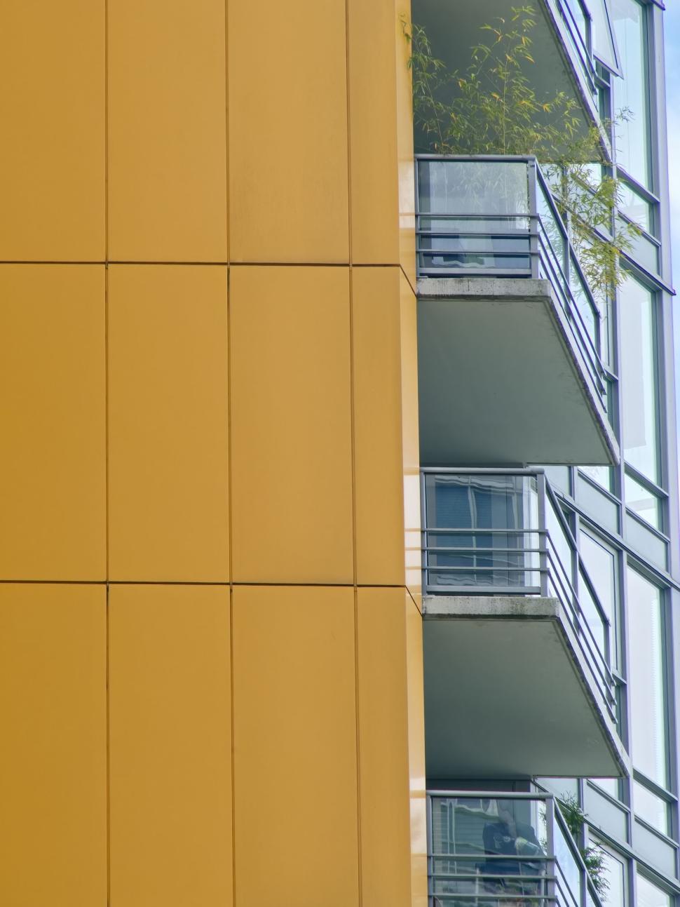 Free Stock Photo of Yellow modern residential building with balconies ...