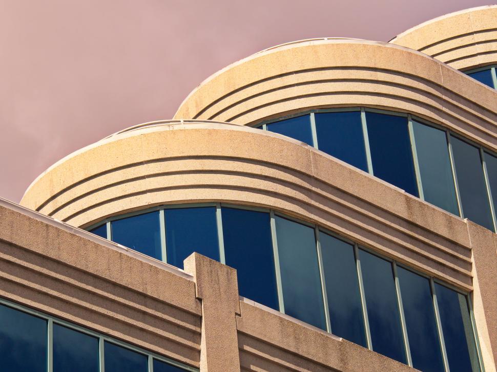 Free Stock Photo of Wavy concrete structure with large windows at dusk ...