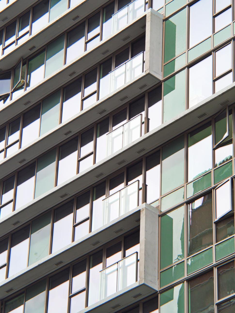 Free Stock Photo of Glass building facade with linear balconies and ...