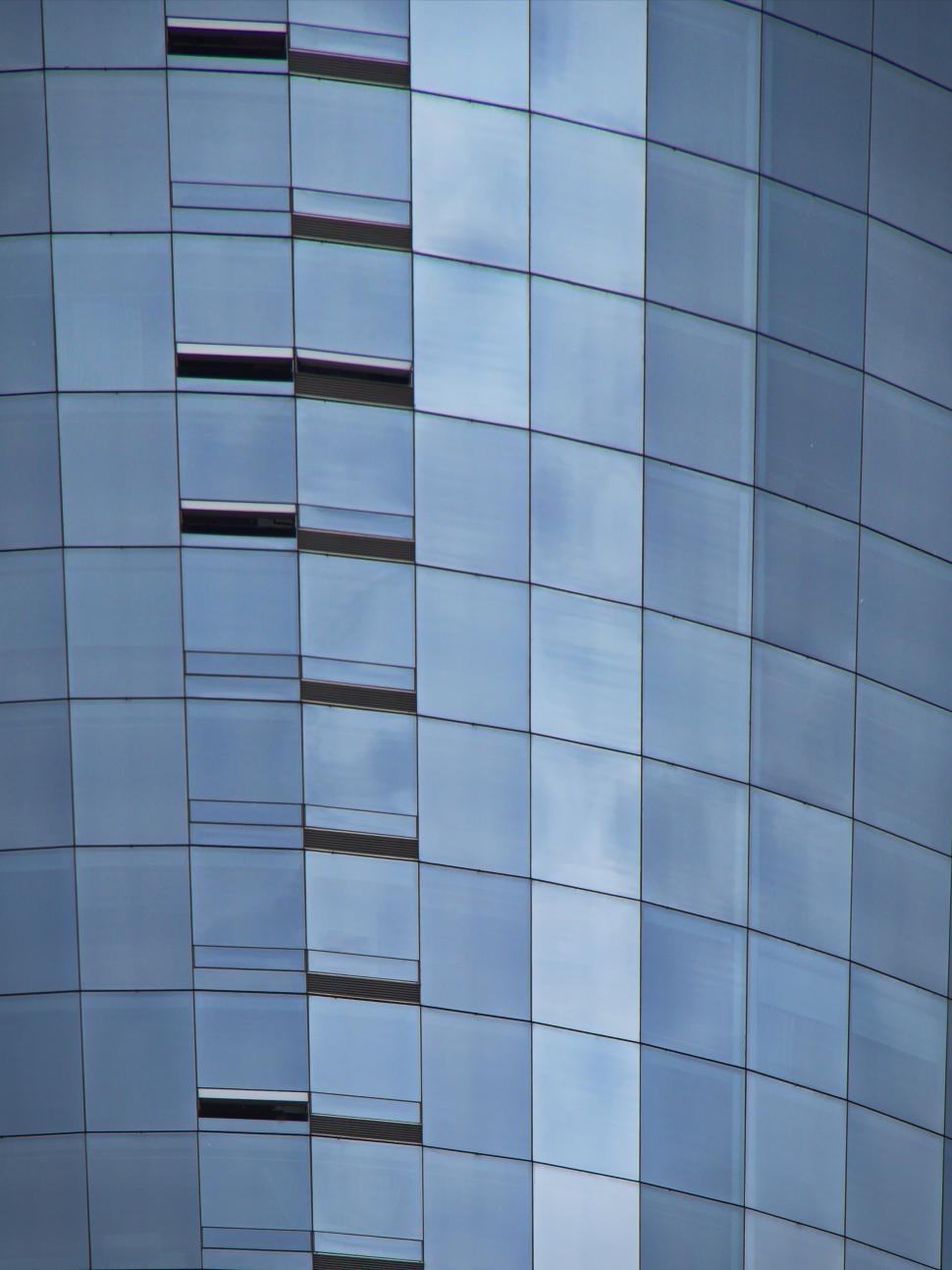 Free Stock Photo of Curved modern skyscraper with glass panel exterior ...