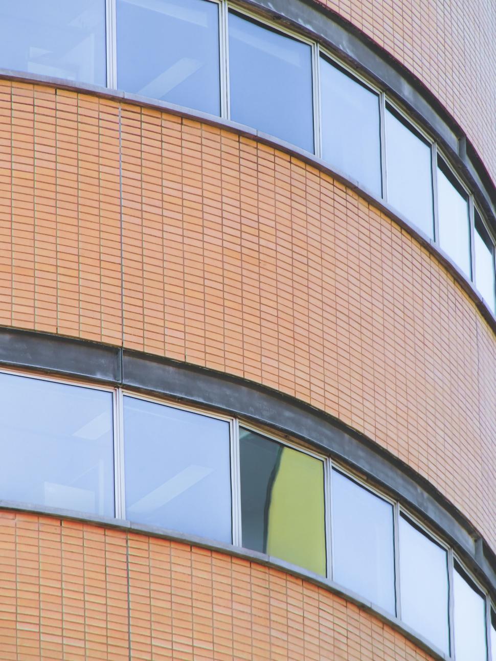 Free Stock Photo of Curved brick building with reflective windows ...