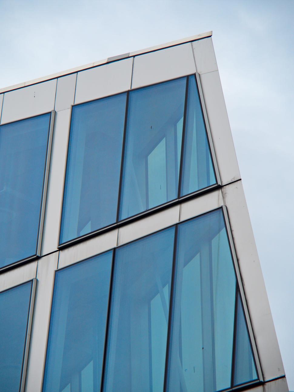 Free Stock Photo of Sharp Angled Modern Glass Building Against Sky ...