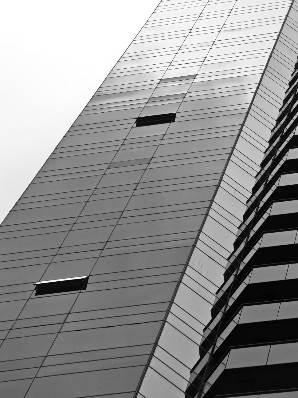 Free Stock Photo of Tall mirrored glass skyscraper reflecting the ...