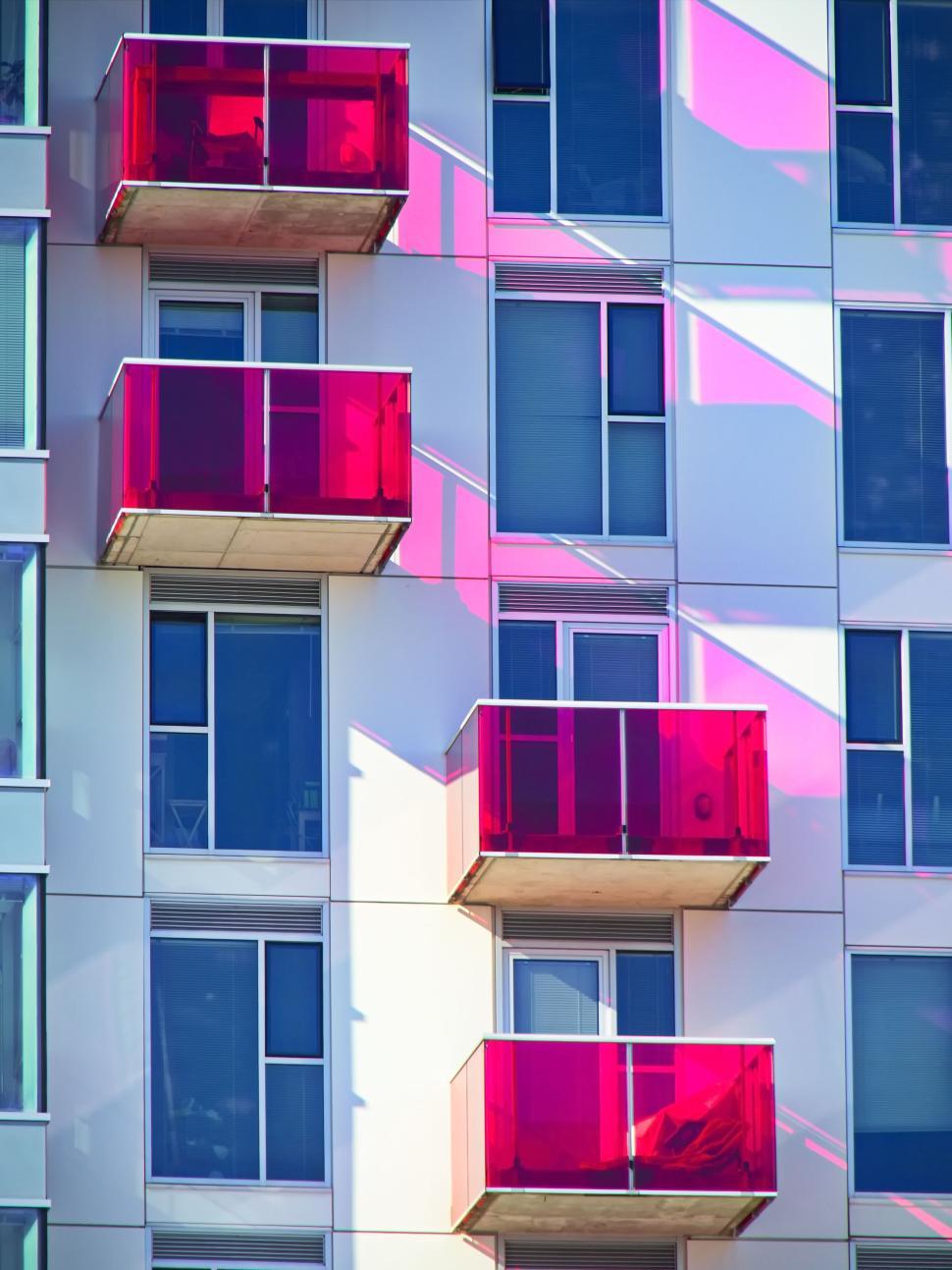Free Stock Photo of Colorful modern building with red glass balconies ...