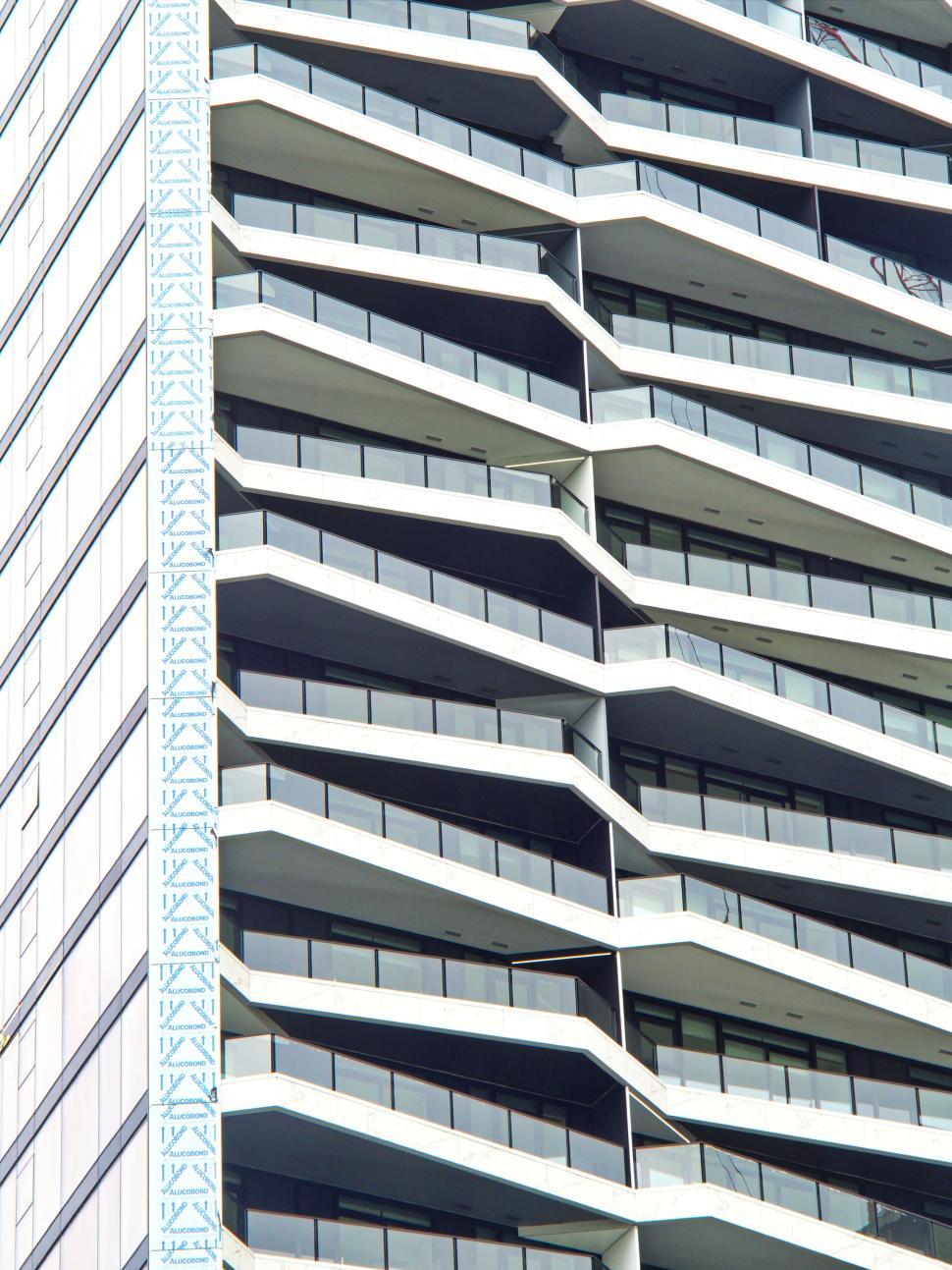 Free Stock Photo of High-rise building with zigzag balconies under blue ...