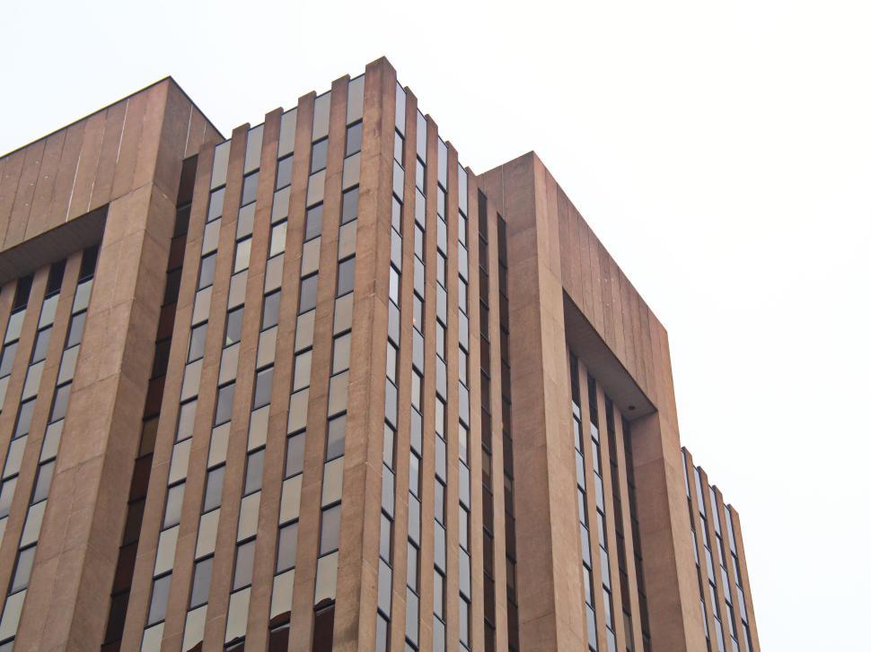 Free Stock Photo of Towering beige skyscraper with repetitive window ...