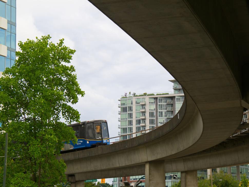 Free Stock Photo of Metro train on curved track with modern buildings ...
