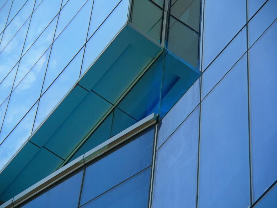 Free Stock Photo of Close-up of a modern glass building with extended ...