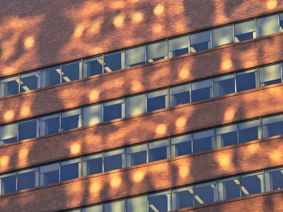 Free Stock Photo of Brick building facade with sunlight patterns on ...