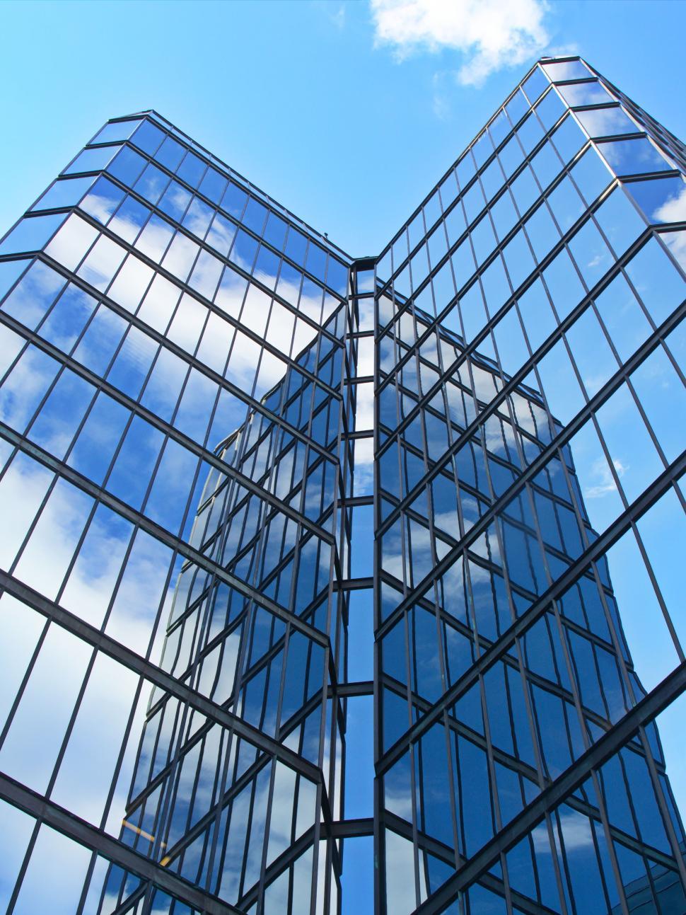 Free Stock Photo of Sharp-edged glass building with reflection of blue ...