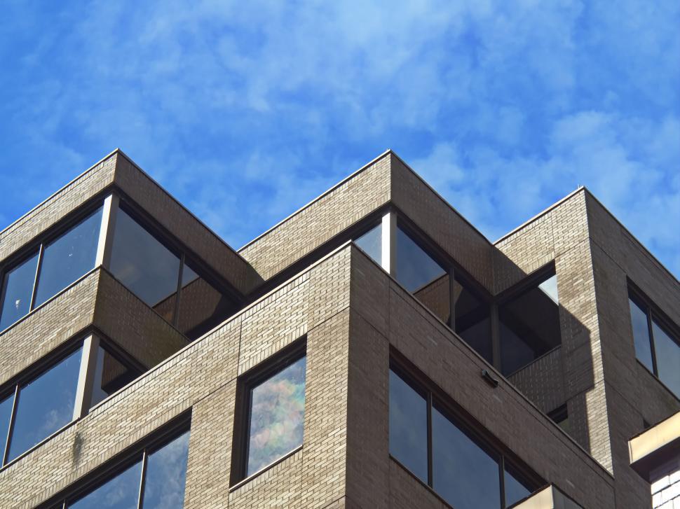 Free Stock Photo of Angular brick building with large windows under ...