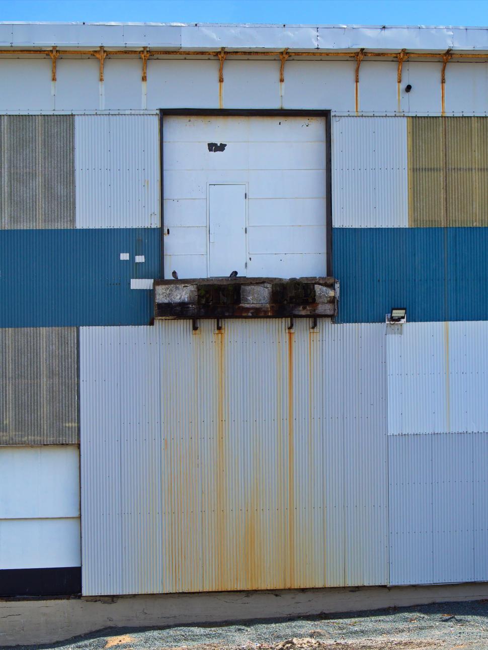 Free Stock Photo of Rusty industrial building with a closed door on the ...