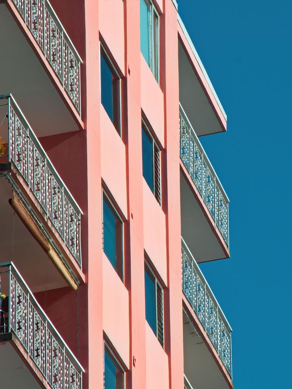 Free Stock Photo of Pink apartment building against clear blue sky ...