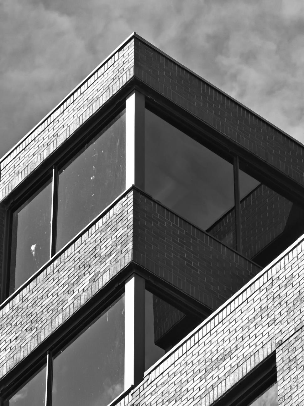 Free Stock Photo of Corner view of brick building with large windows ...