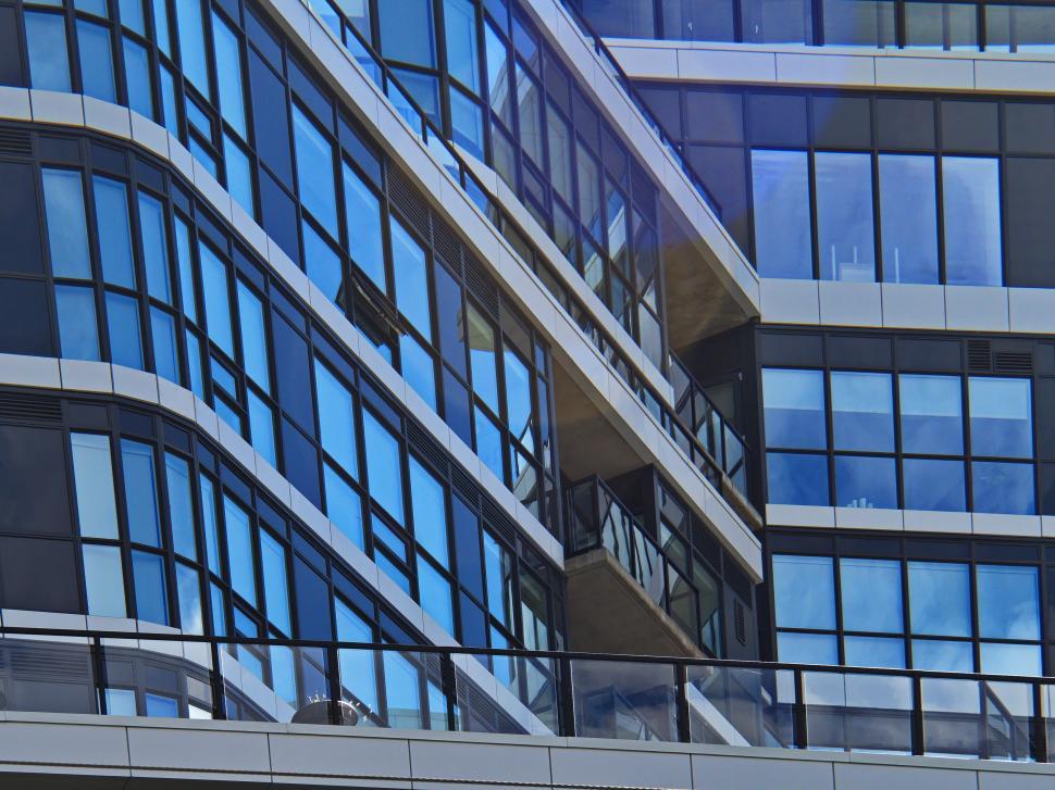 Free Stock Photo of Complex design of modern glass walled building ...