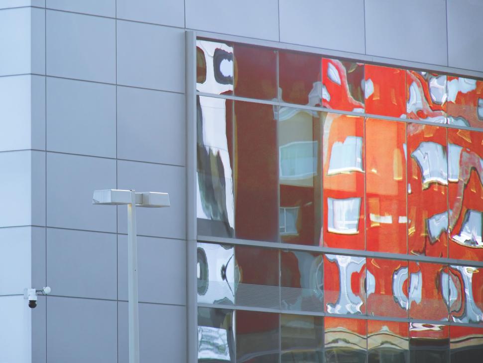 Free Stock Photo of Abstract reflection of a red building on mirrored ...
