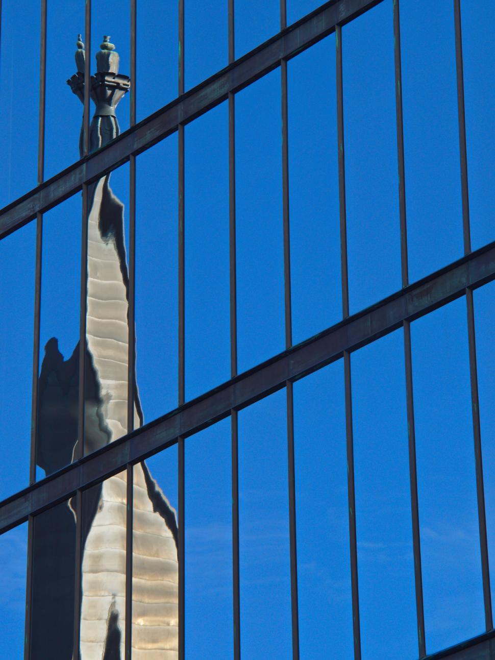 Free Stock Photo of Distorted monument reflection in tall glass ...