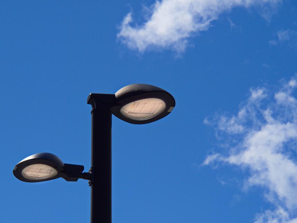 Free Stock Photo of Double streetlights against a bright blue sky view ...