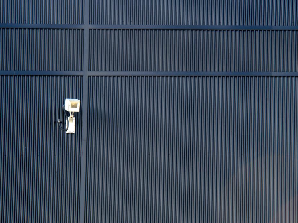 Free Stock Photo of Security camera mounted on a black ridged wall ...