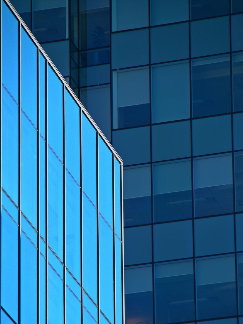 Free Stock Photo of Blue glass building with reflections on a sunny day ...