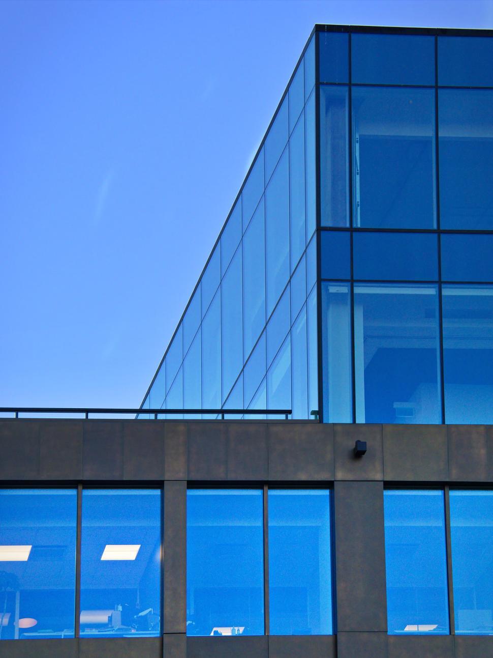 Free Stock Photo of Modern blue glass corner building reflecting the ...