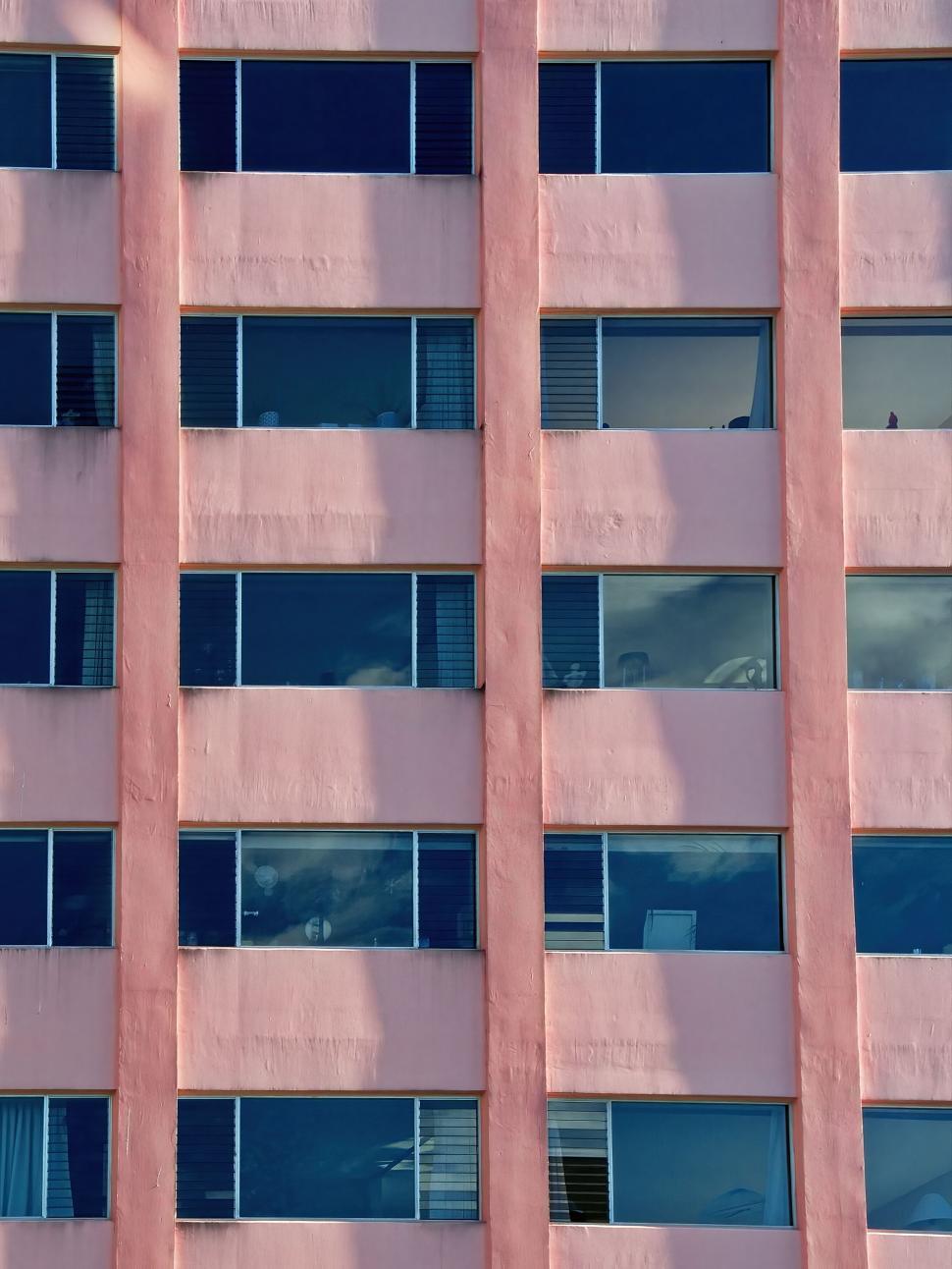Free Stock Photo of Pastel pink building with multiple uniform windows ...
