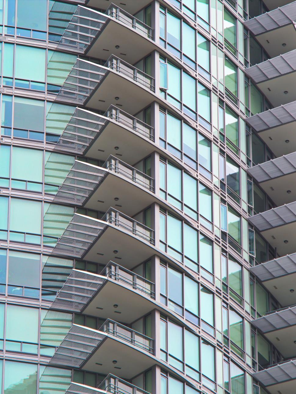 Free Stock Photo of Curved glass building with balconies in modern city ...