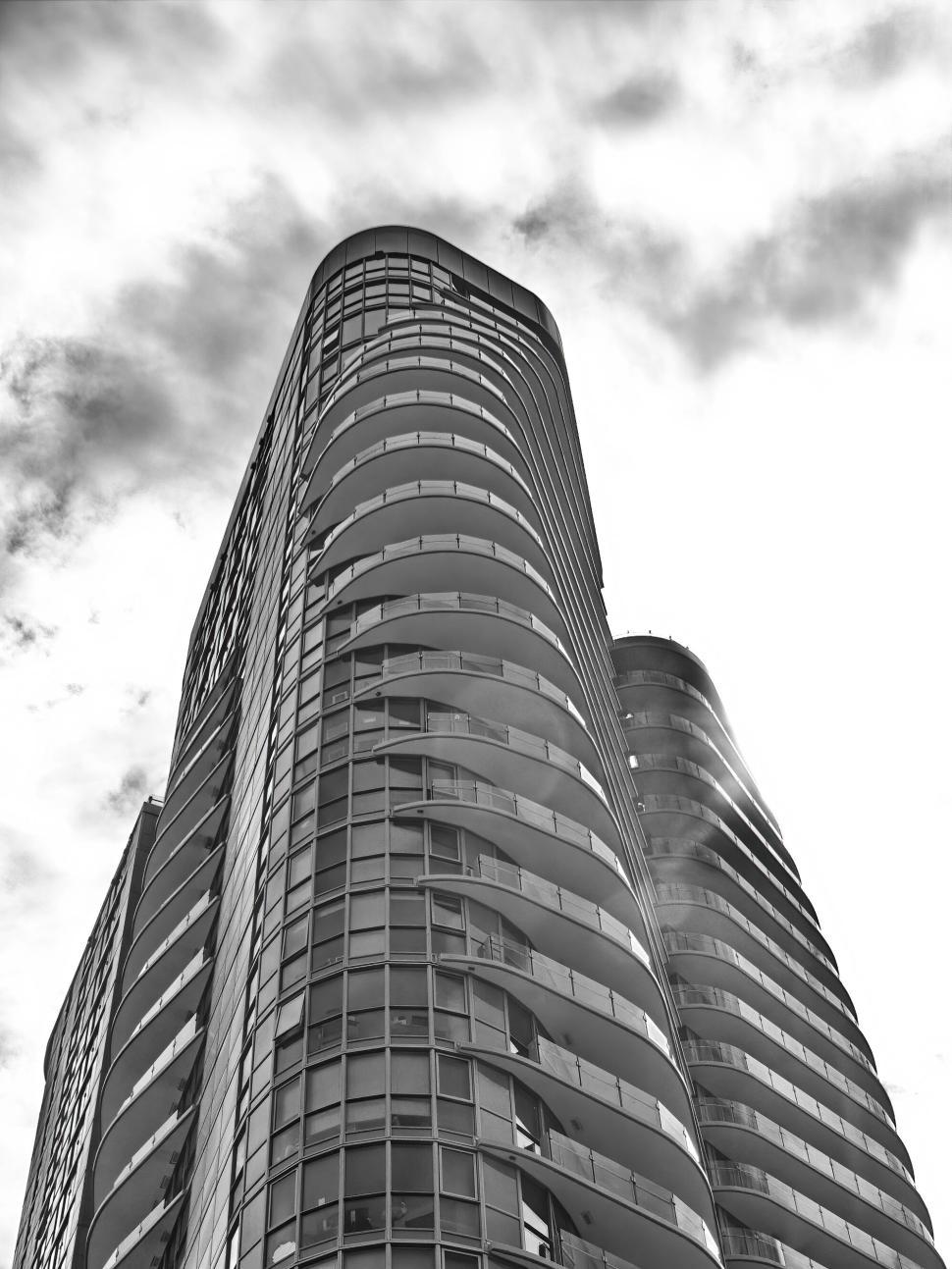 Free Stock Photo of Tall curved building in black and white reaching ...
