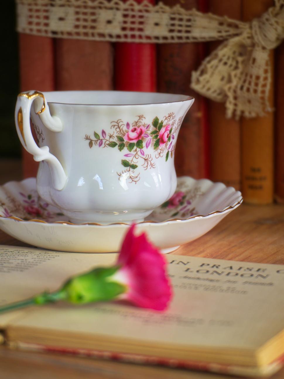 Free Stock Photo of Ornate teacup with floral design on a saucer in ...