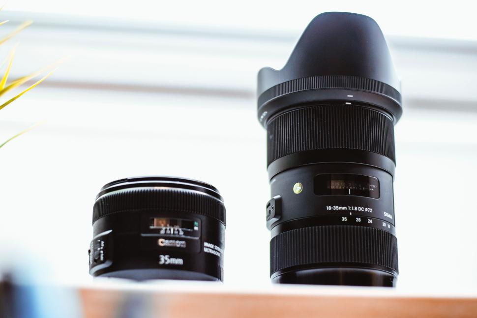 Free Stock Photo of Two camera lenses on a white surface in bright ...
