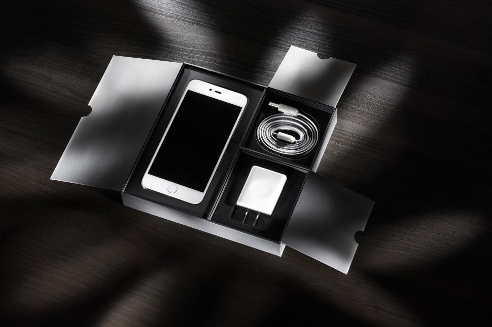 Free Stock Photo of Smartphone in packaging with accessories on table ...