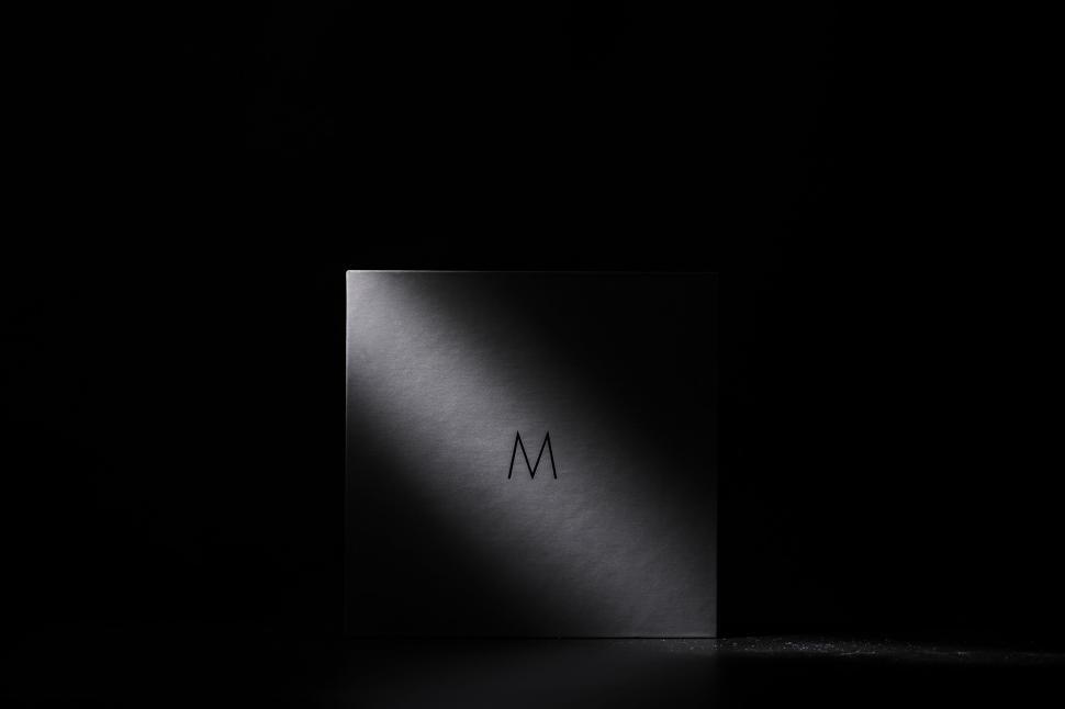 Free Stock Photo of Closed black packaging box with elegant letter M ...