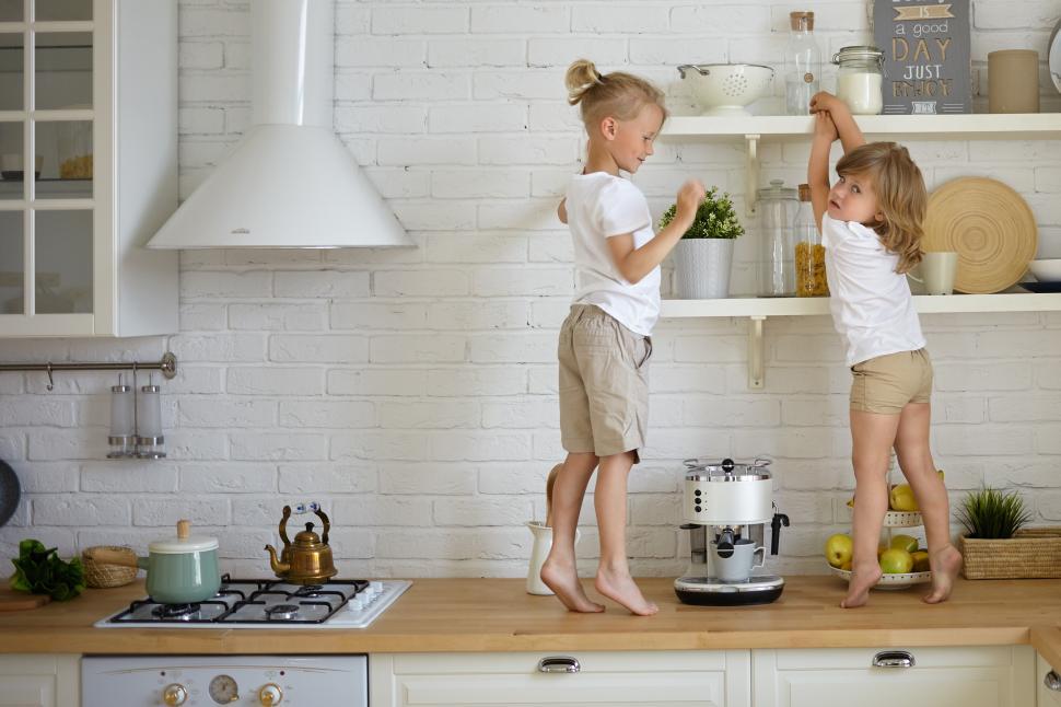 Free Stock Photo of Two restless fidgety children wearing casual ...