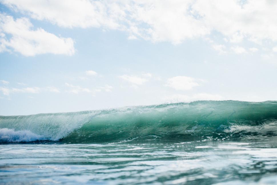 Free Stock Photo of Long wave approaching the shore under a bright sky ...