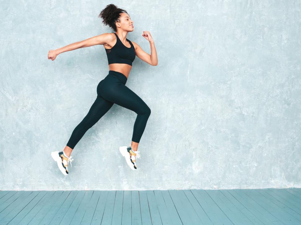 Free Stock Photo of Person jumping in black workout gear, mid-air ...
