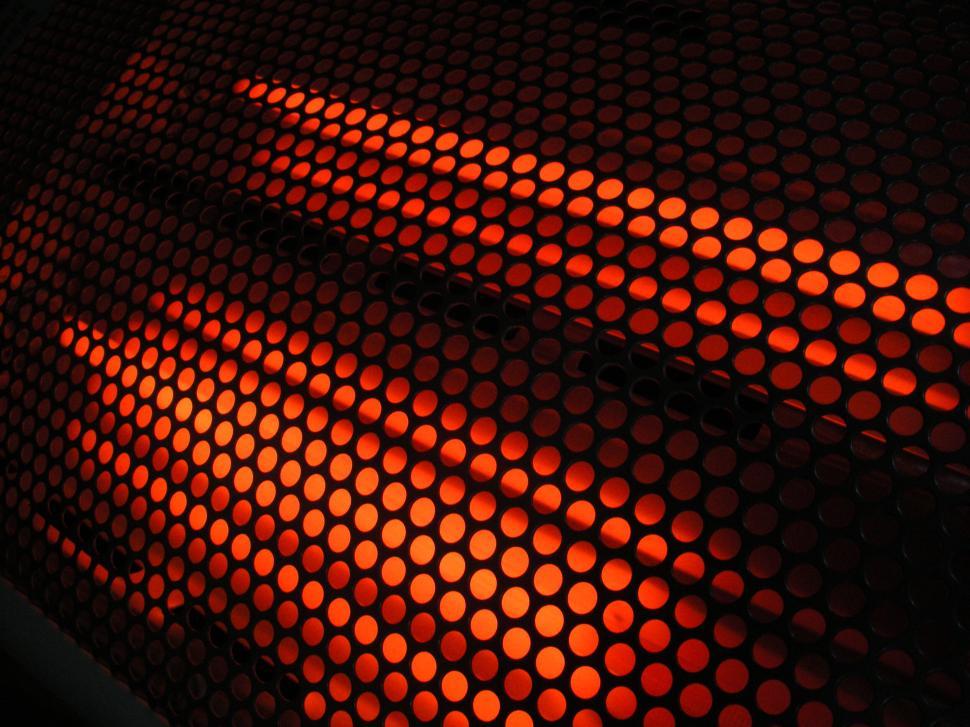 Free Stock Photo of Close-up view of a glowing orange metal mesh heater ...