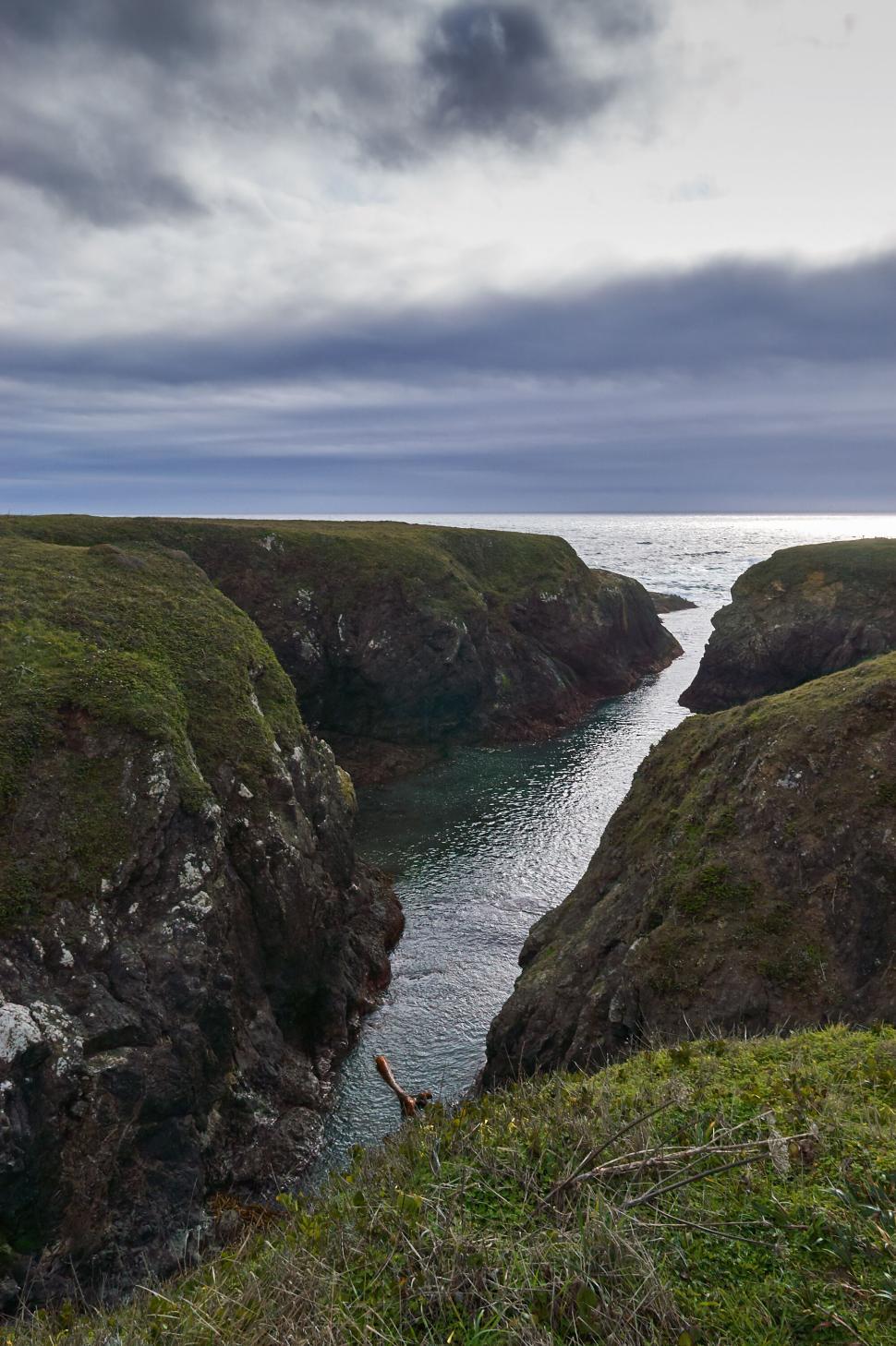 Free Stock Photo of Narrow waterway between sheer cliffs under cloudy ...