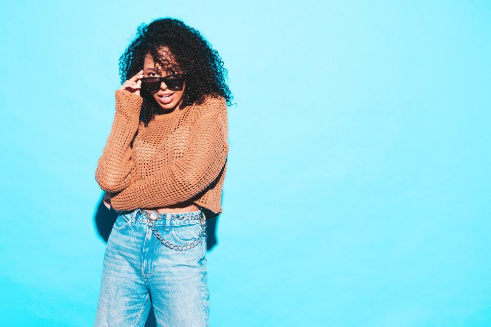 Free Stock Photo of Casual fashion portrait against a blue backdrop ...