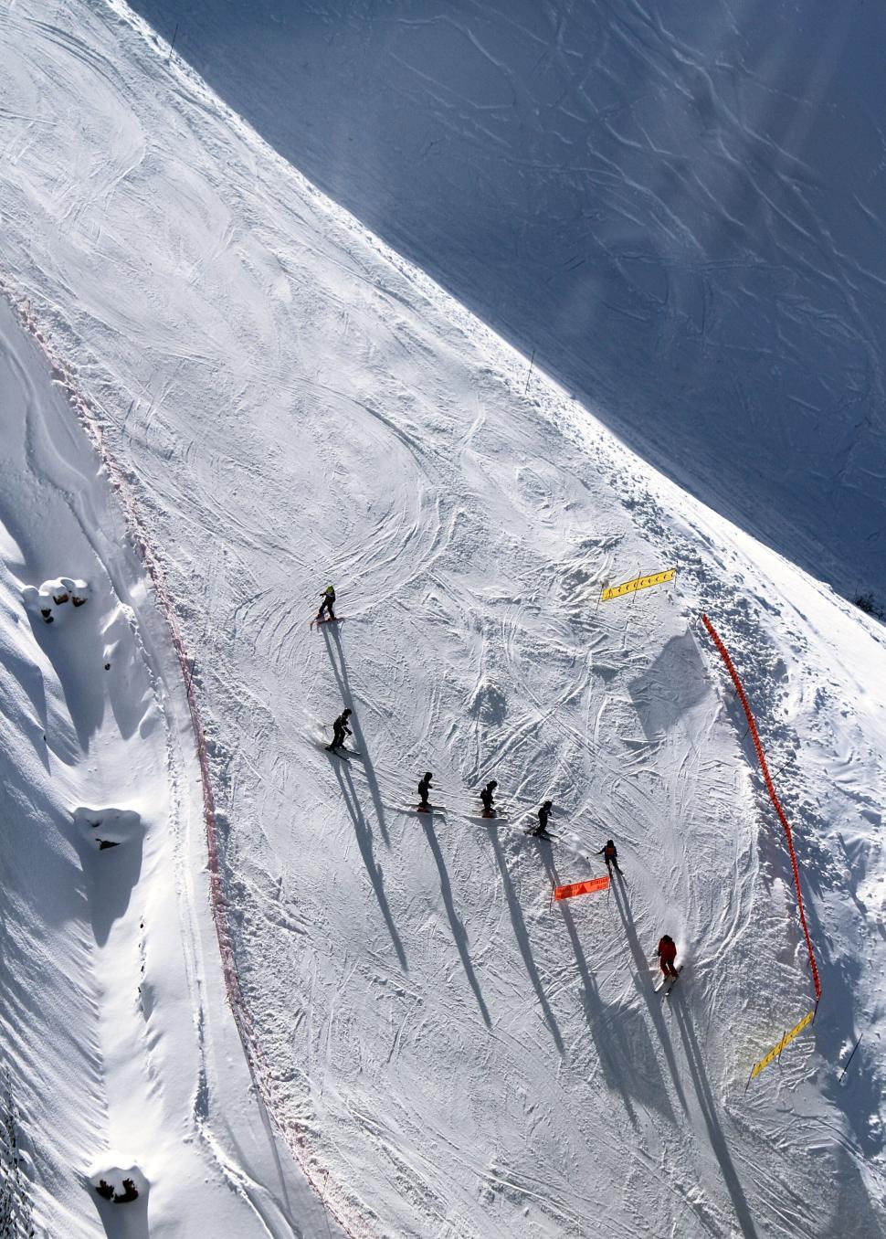 Free Stock Photo of Skiers going downhill on a snowy slope in the ...